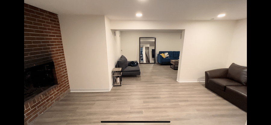 Furnished basement with private entrance, room, and bathroom. W/D in unit.